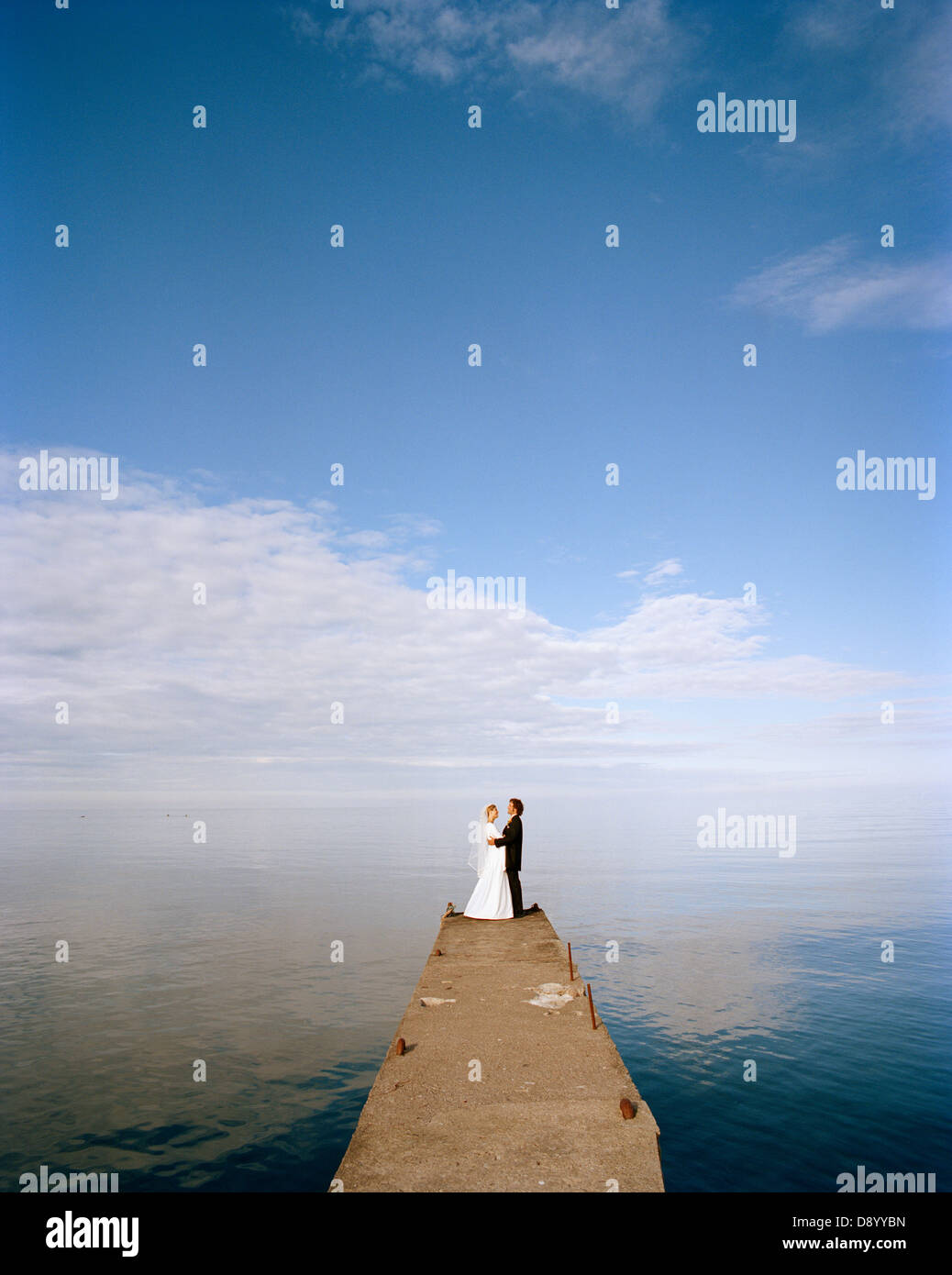 A bridal couple on a jetty, Sweden Stock Photo - Alamy