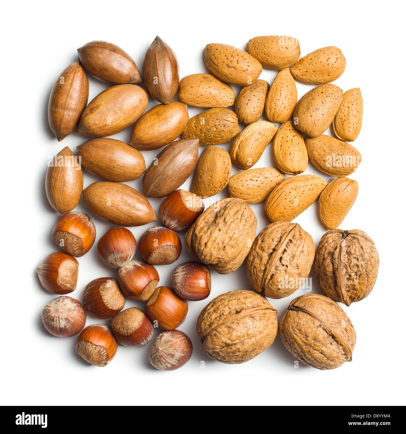 various unpeeled nuts on white background Stock Photo - Alamy
