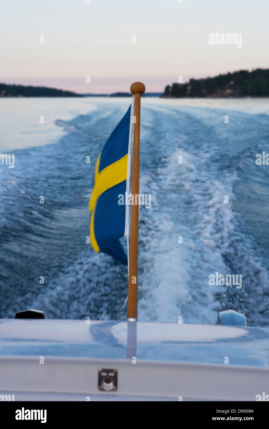 The swedish flag in the stern of a motorboat Stock Photo - Alamy