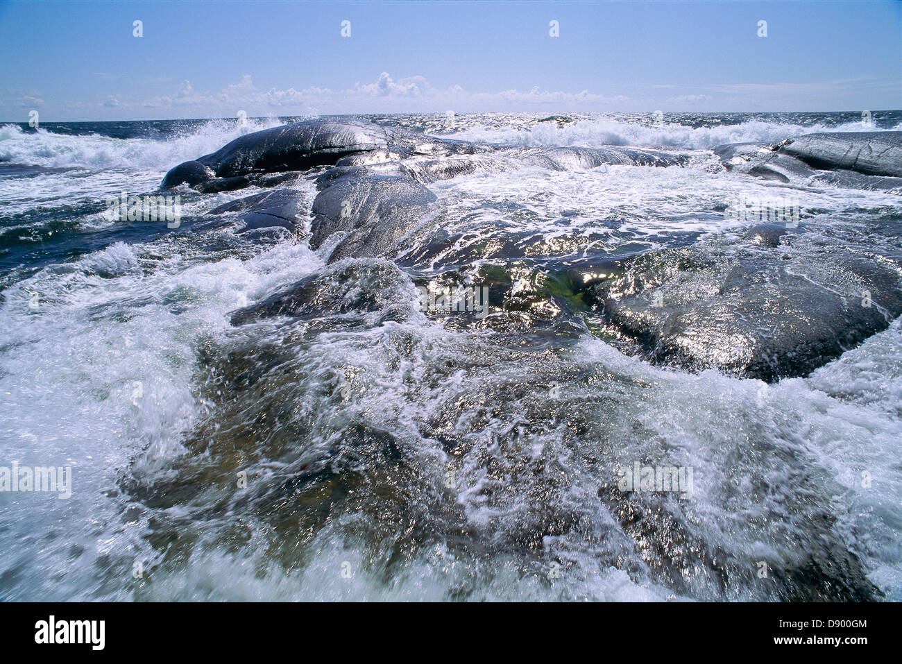 Waves hitting the rocks Stock Photo - Alamy