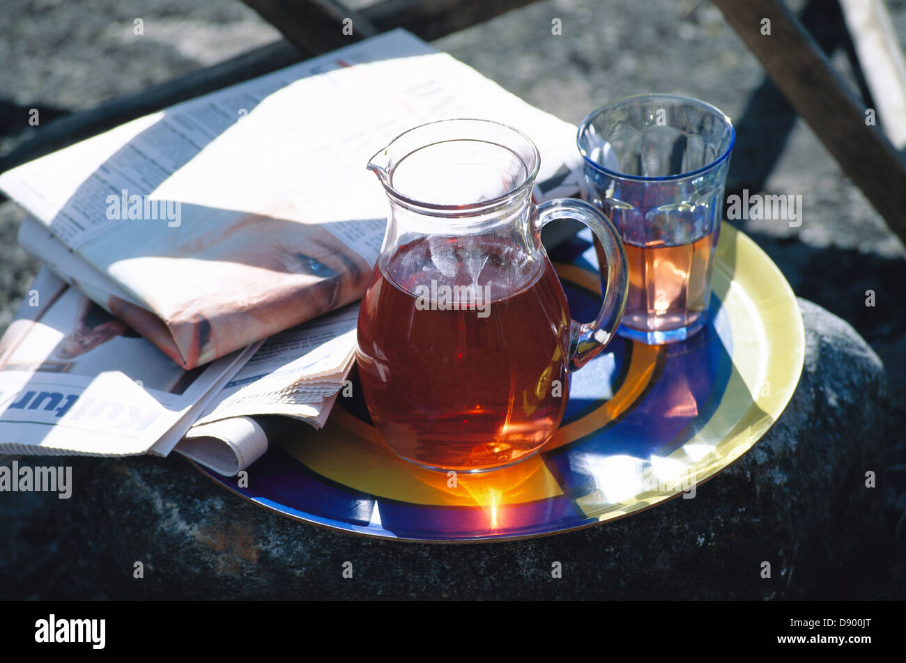 A tray with newspaper and a jug of lemonade Stock Photo - Alamy