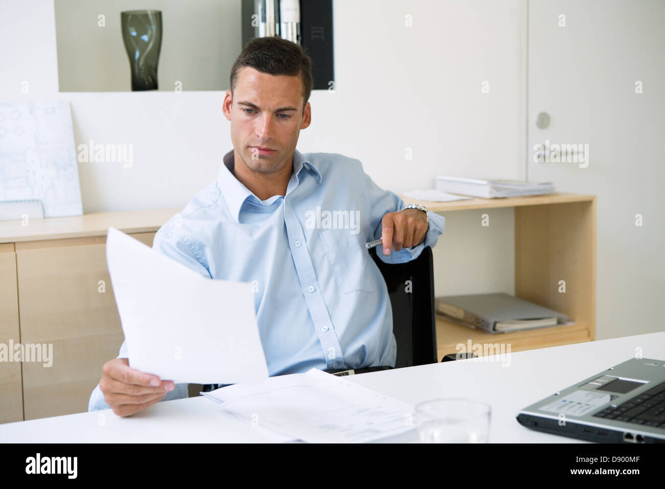 A man in an office Stock Photo - Alamy
