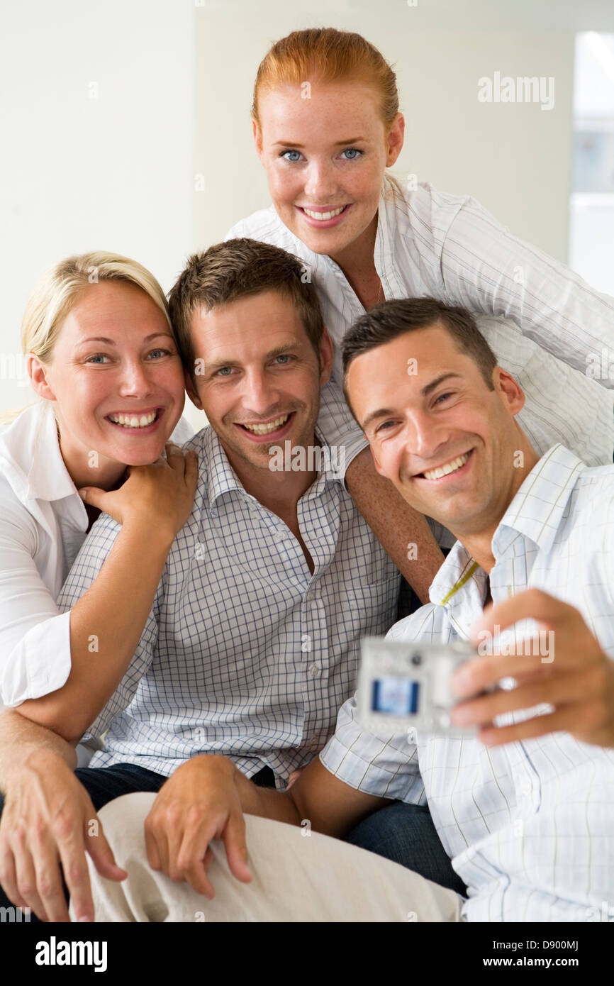 Portrait of four persons in an office Stock Photo - Alamy