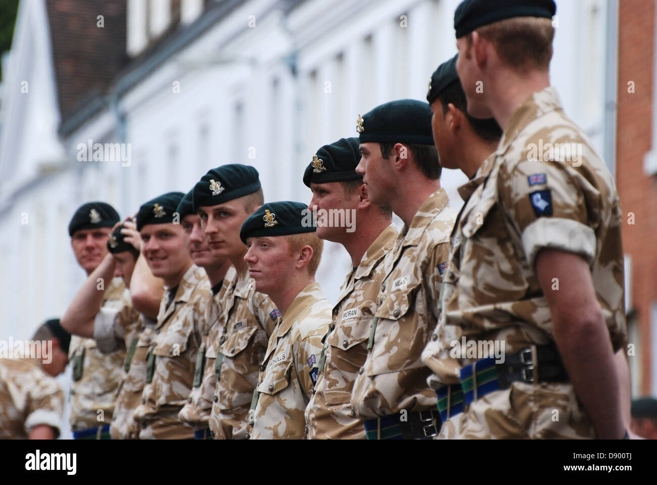 A line of soldiers await the start of a homecoming parade Stock Photo ...