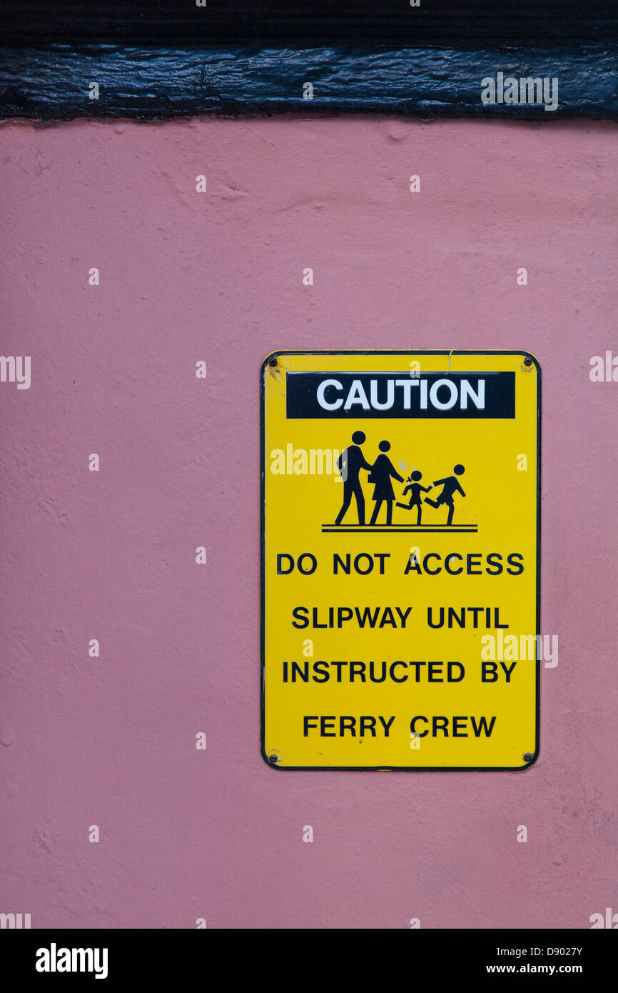 Caution sign alongside a ferry slipway Stock Photo - Alamy