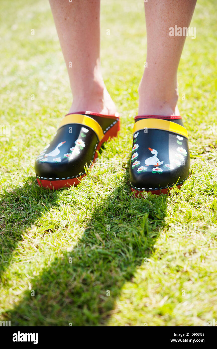 Person wearing clogs, close-up Stock Photo - Alamy