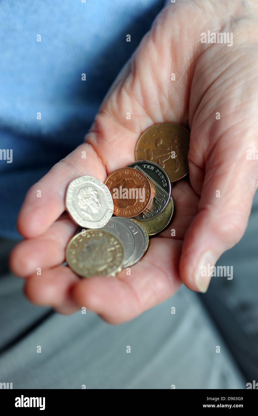 Elderly caucasian woman sorting out her money Stock Photo - Alamy
