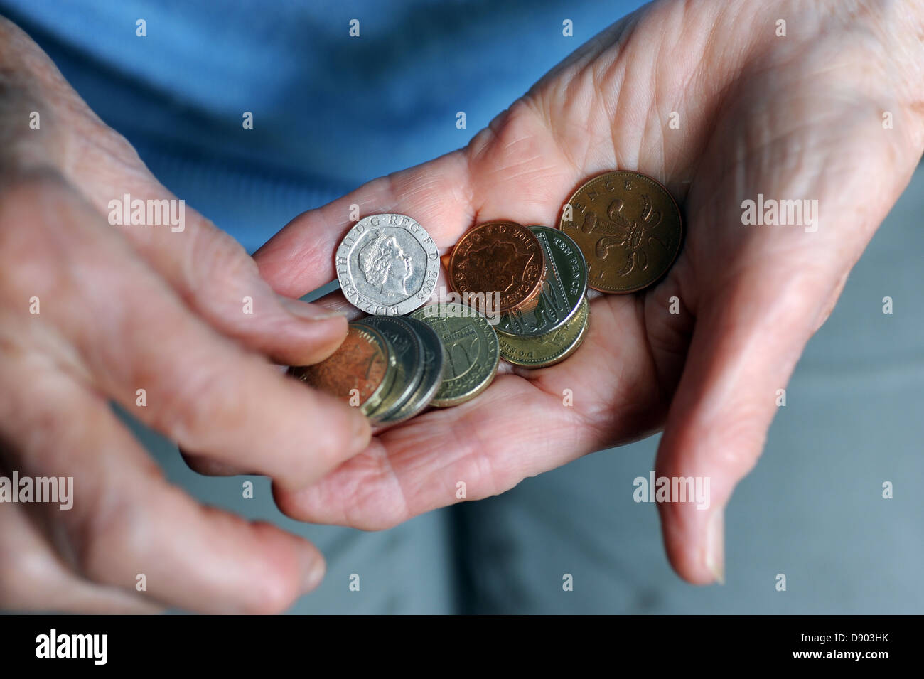 Elderly caucasian woman sorting out her money Stock Photo - Alamy