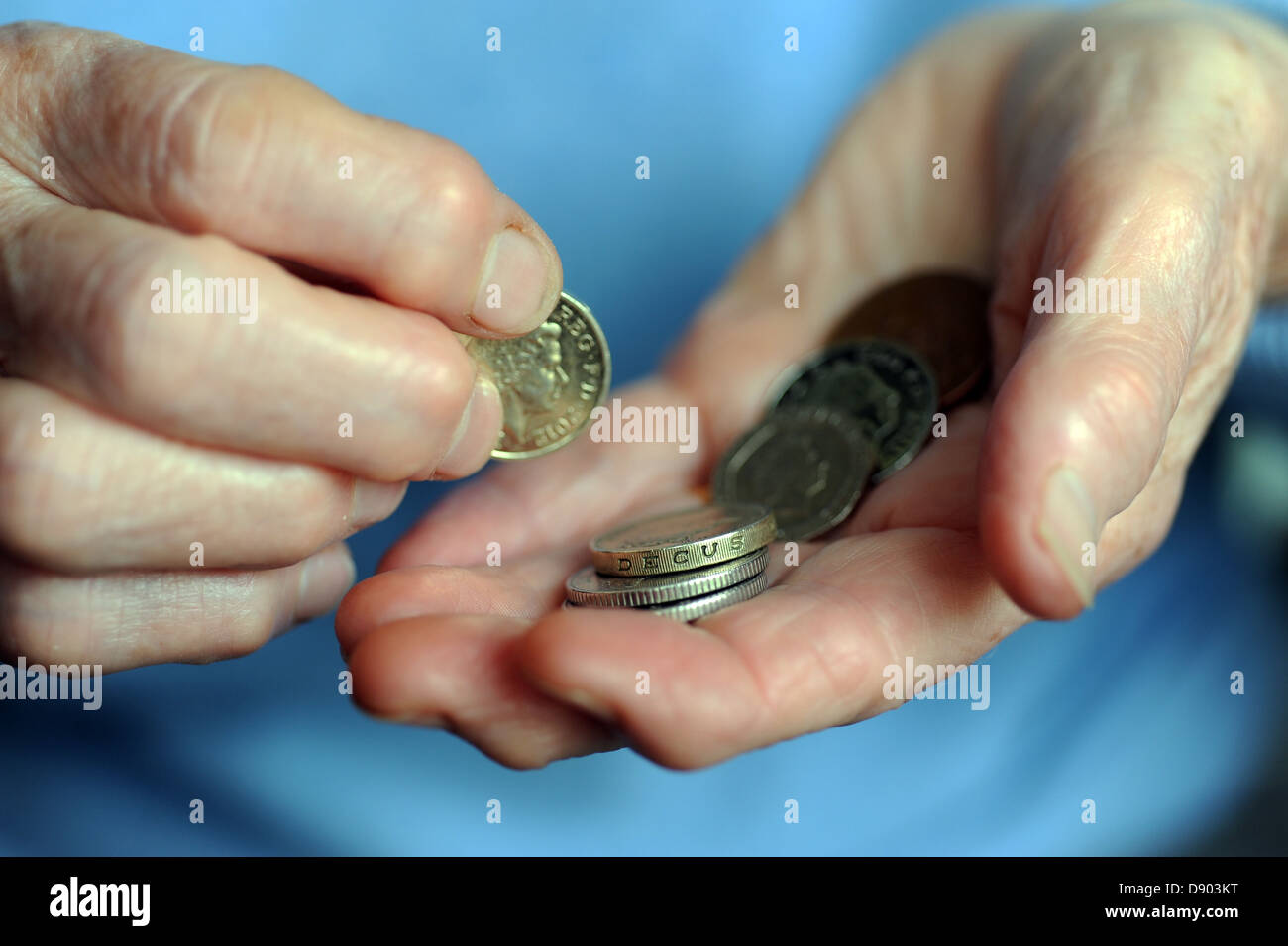 Hand sorting coins hi-res stock photography and images - Alamy