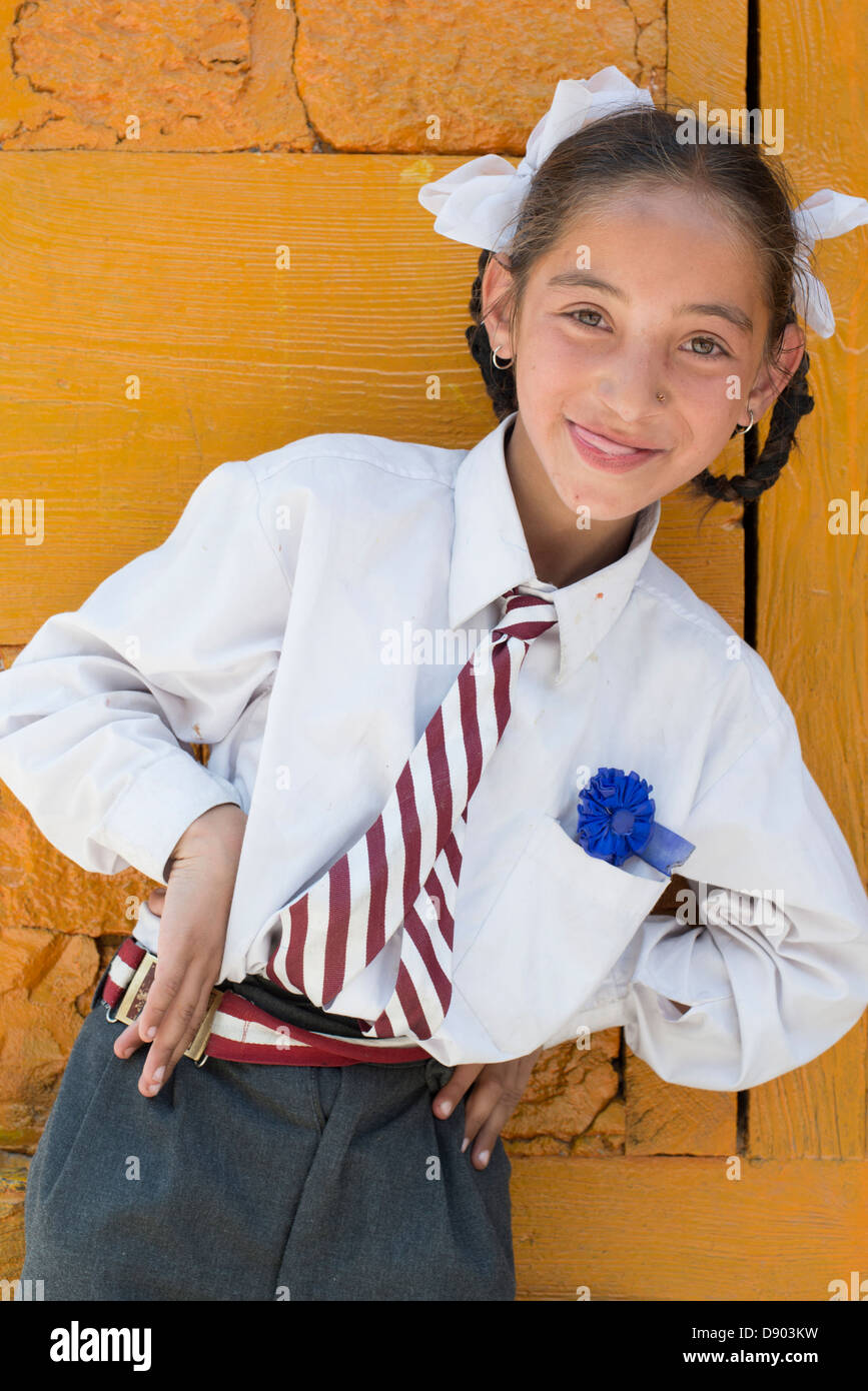 A High school student poses for the camera in the Himalayan town of ...
