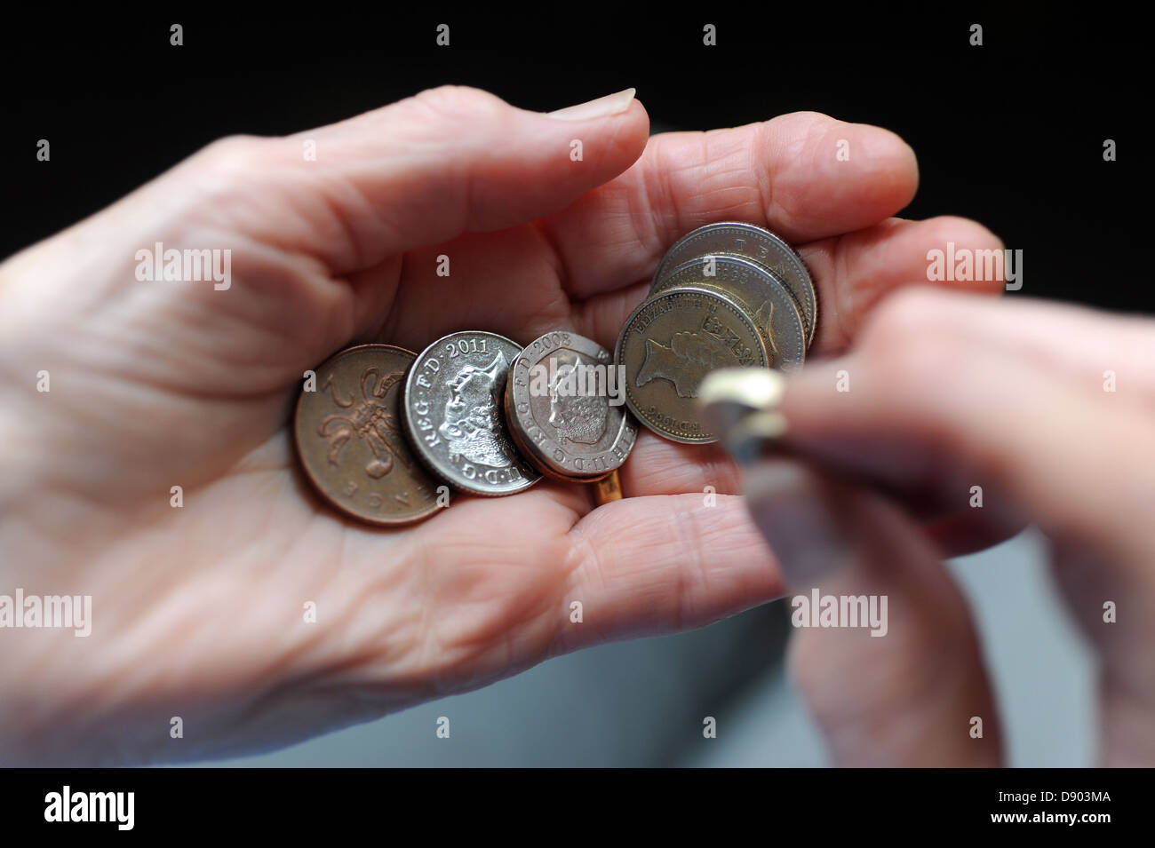 Elderly caucasian woman sorting out her money Stock Photo - Alamy