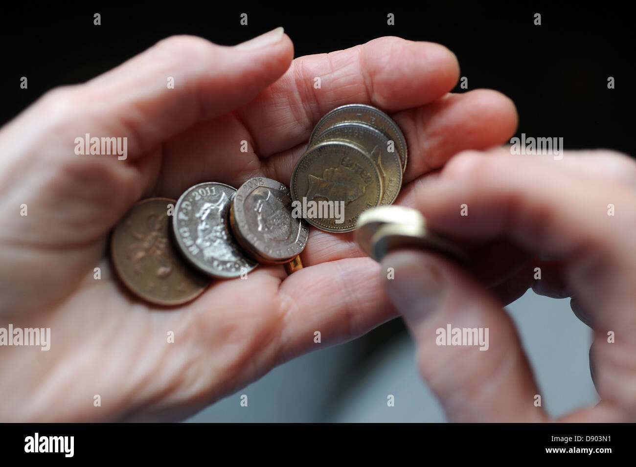 Elderly caucasian woman sorting out her money Stock Photo - Alamy