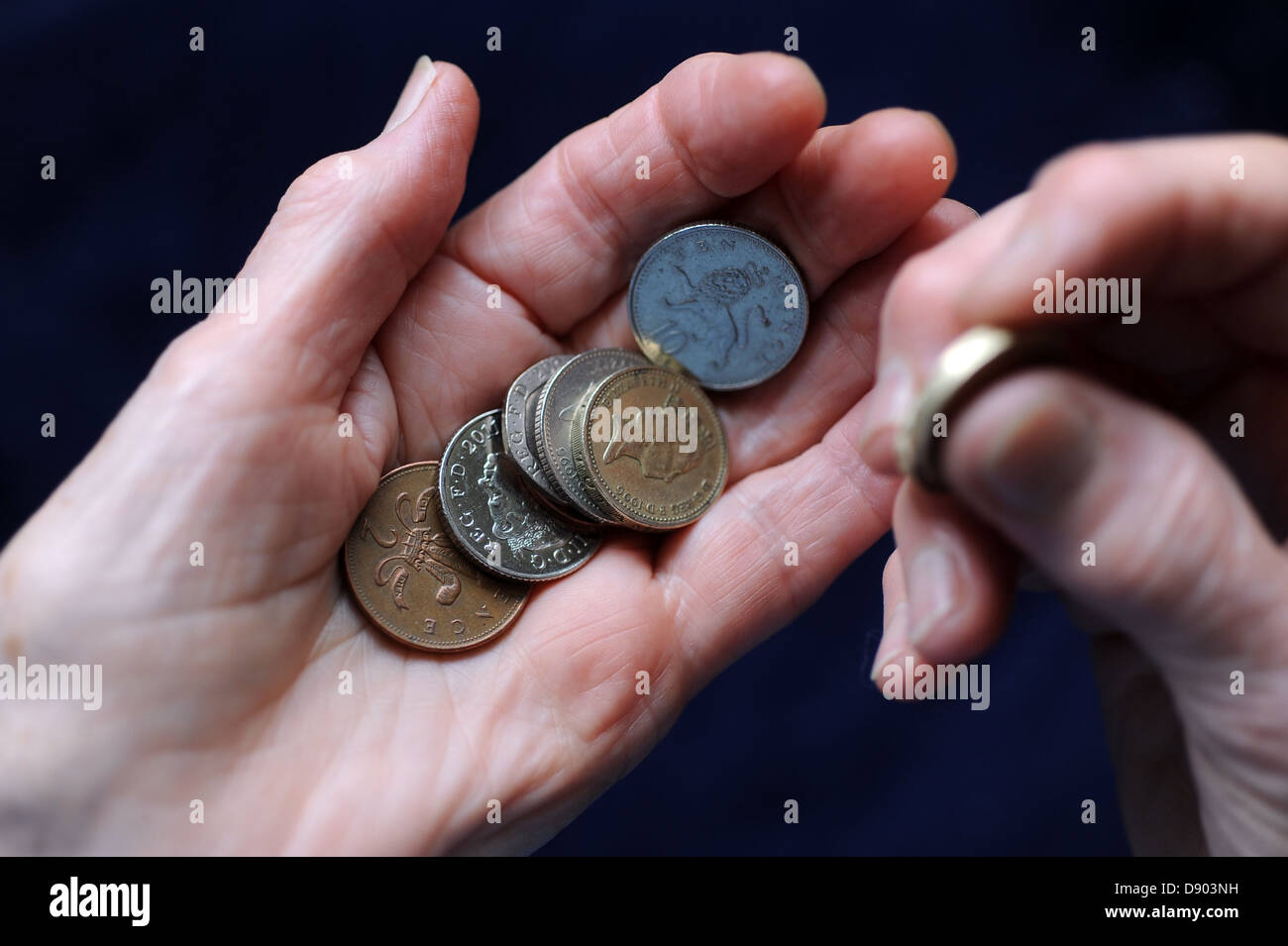Elderly caucasian woman sorting out her money Stock Photo - Alamy