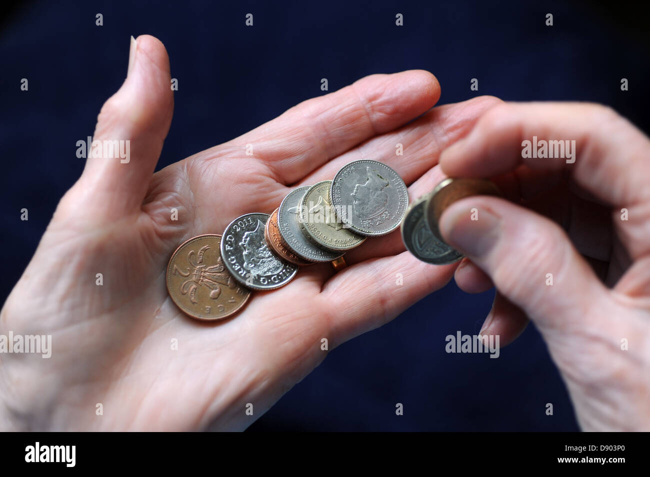 Elderly caucasian woman sorting out her money Stock Photo - Alamy