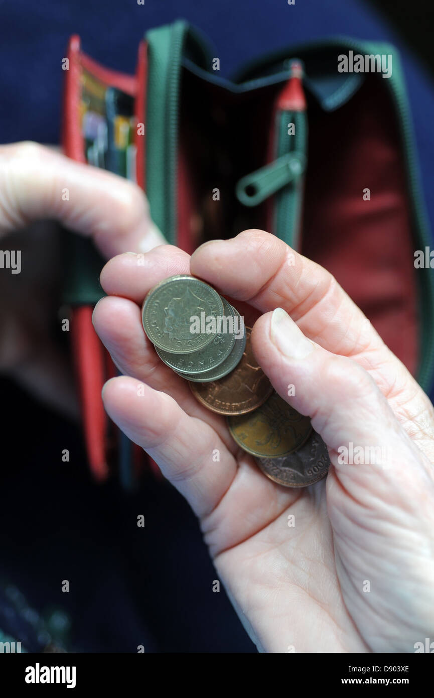 Elderly caucasian woman sorting out her money Stock Photo - Alamy