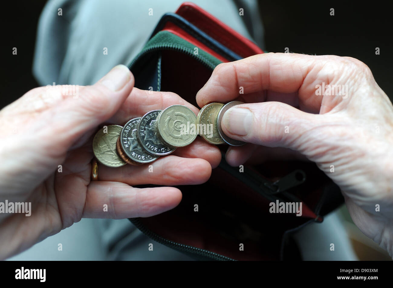Elderly caucasian woman sorting out her money Stock Photo - Alamy