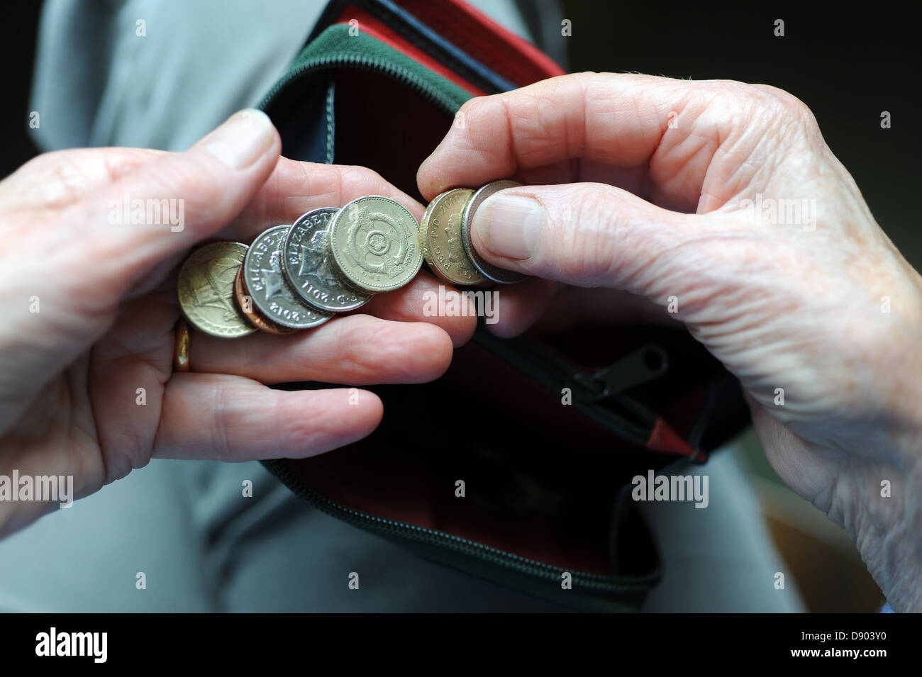 Elderly caucasian woman sorting out her money Stock Photo - Alamy