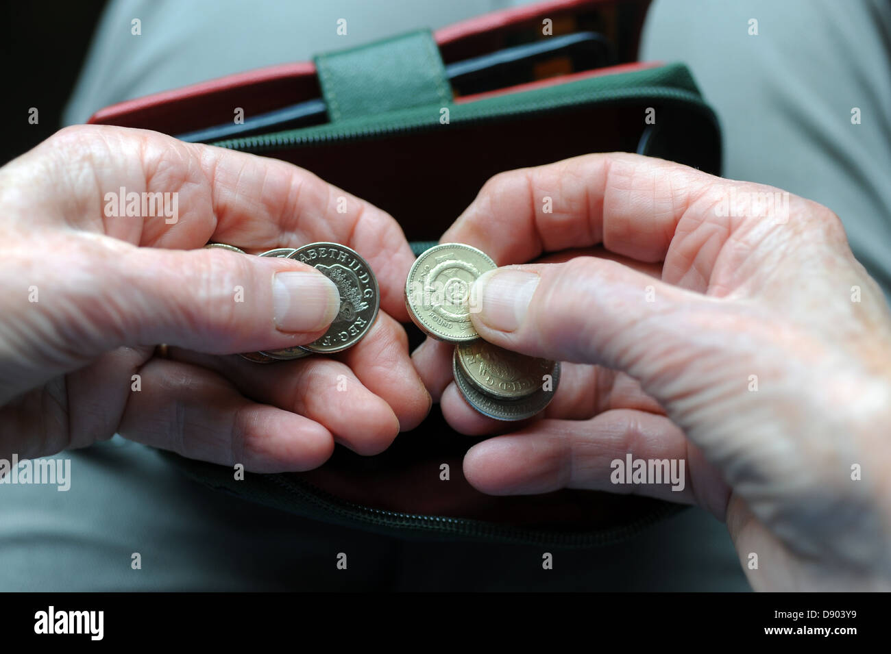 Elderly caucasian woman sorting out her money Stock Photo - Alamy