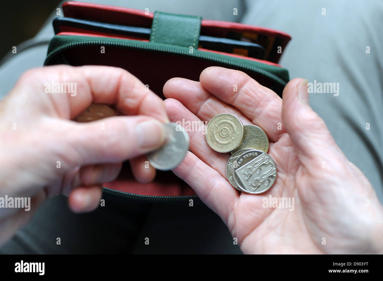 Elderly caucasian woman sorting out her money Stock Photo - Alamy
