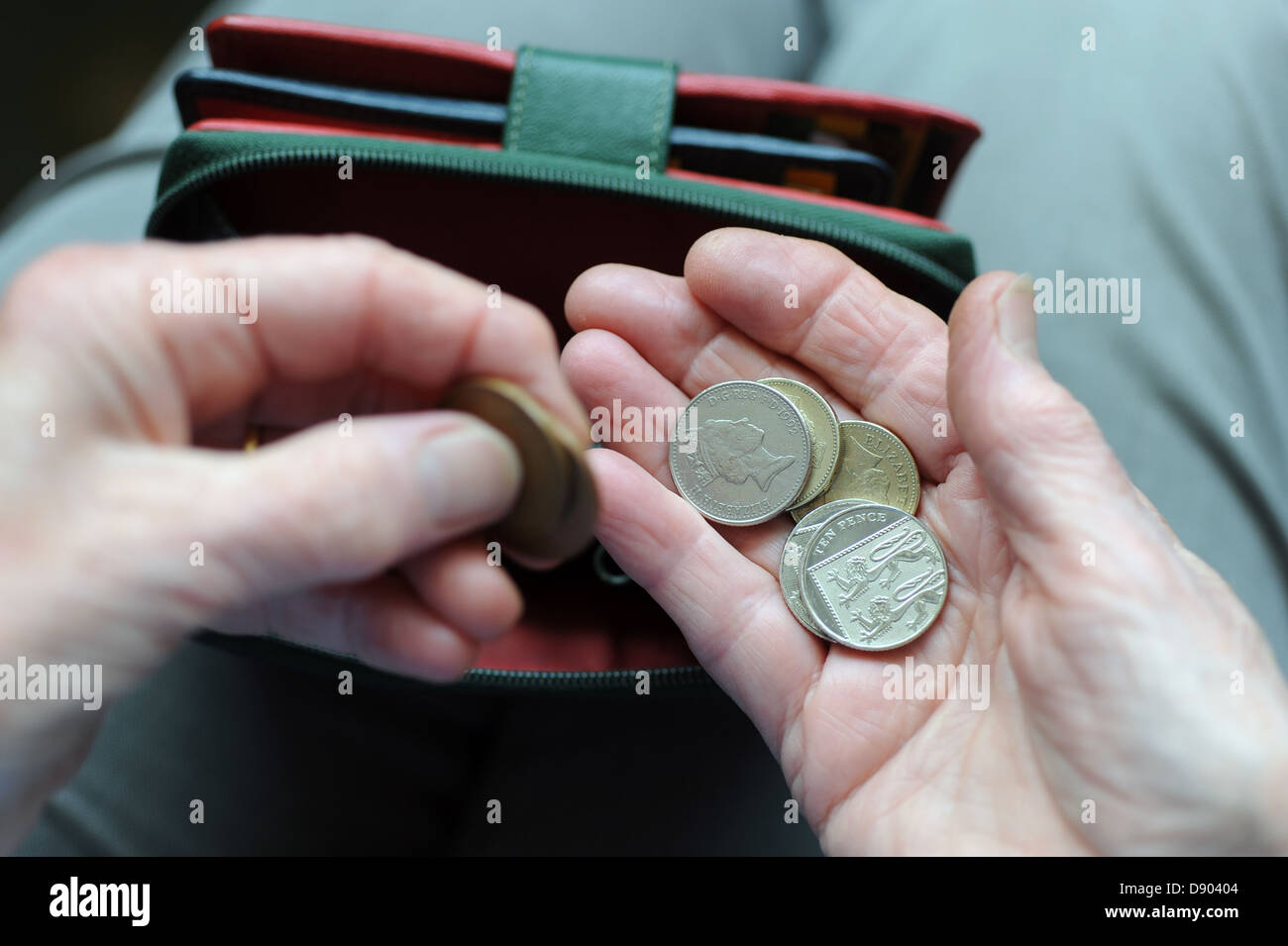 Elderly caucasian woman sorting out her money Stock Photo - Alamy