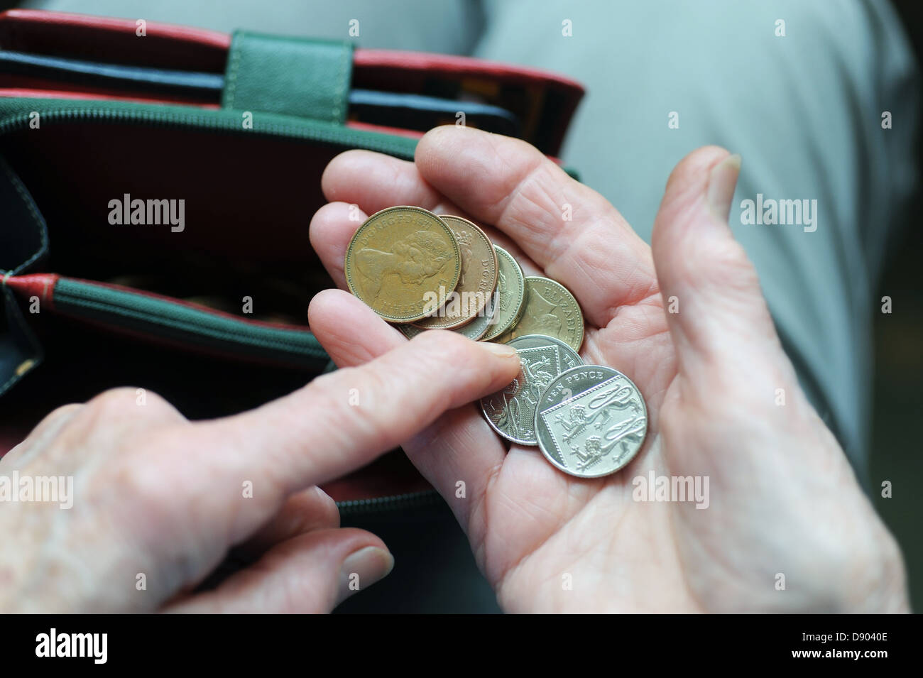 Elderly caucasian woman sorting out her money Stock Photo - Alamy