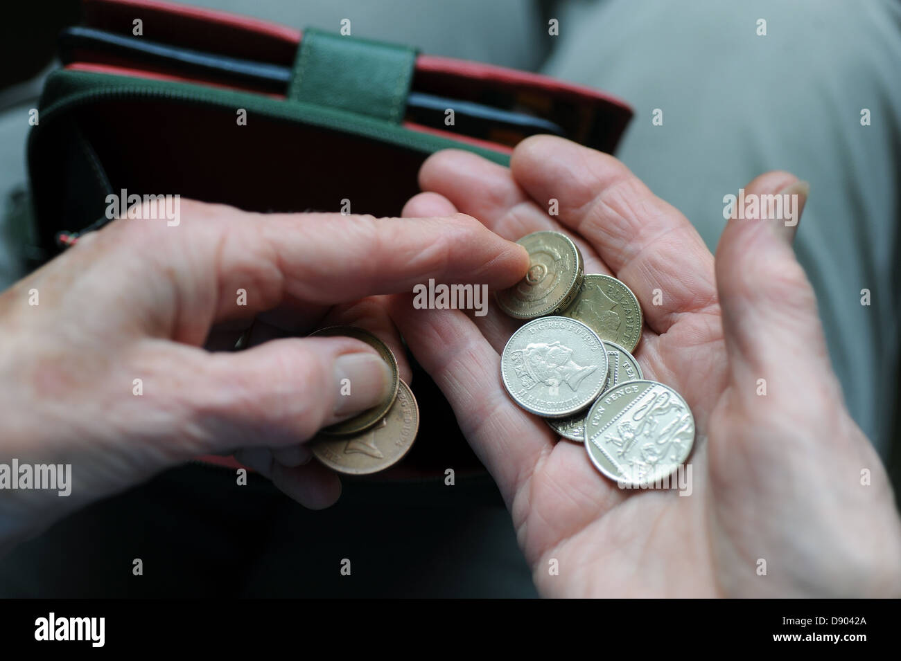 Elderly caucasian woman sorting out her money Stock Photo - Alamy