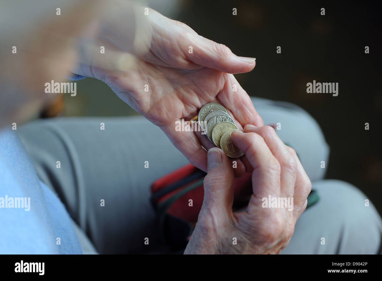Elderly caucasian woman sorting out her money Stock Photo - Alamy
