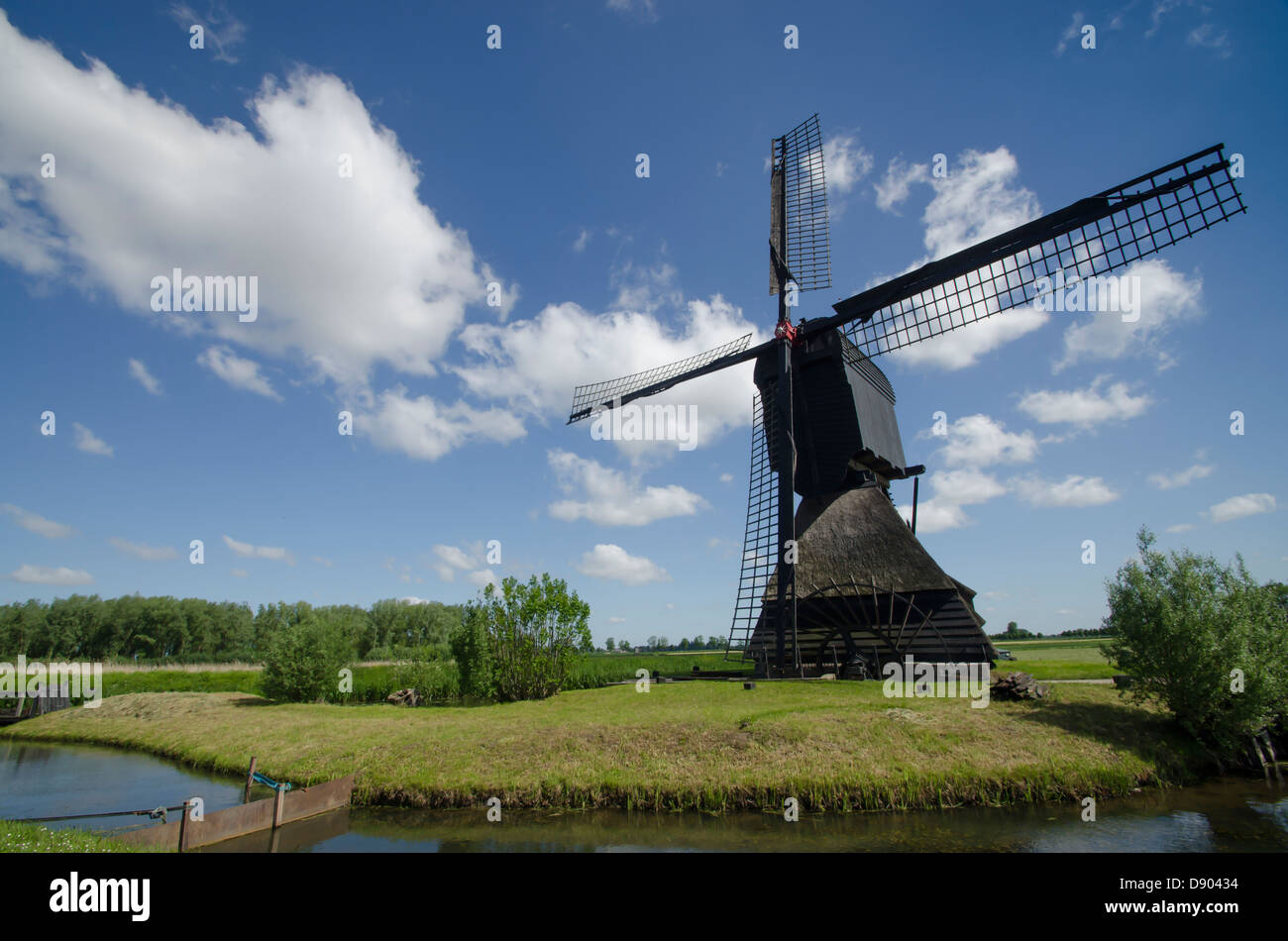 Windmill in dutch countryside Stock Photo - Alamy