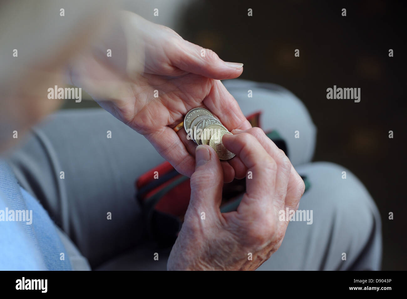 Elderly caucasian woman sorting out her money Stock Photo - Alamy