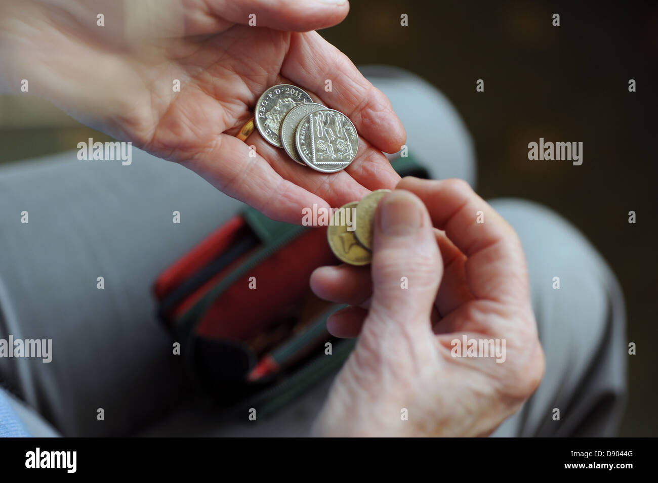 Elderly caucasian woman sorting out her money Stock Photo - Alamy