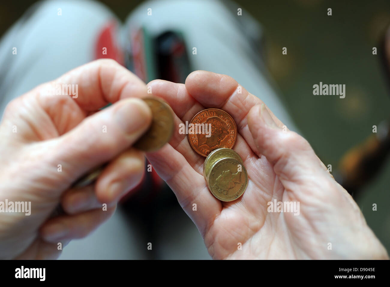 Elderly caucasian woman sorting out her money Stock Photo - Alamy