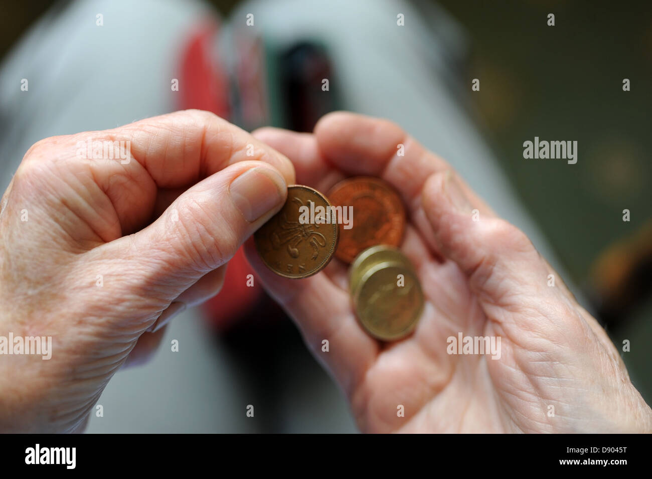 Elderly caucasian woman sorting out her money Stock Photo - Alamy
