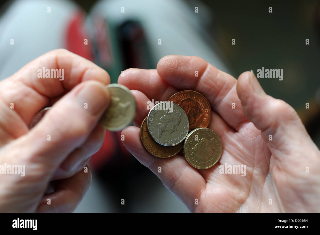 Elderly caucasian woman sorting out her money Stock Photo - Alamy