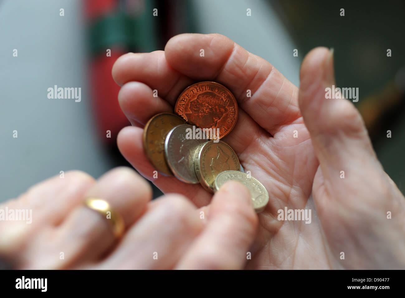 Elderly caucasian woman sorting out her money Stock Photo - Alamy