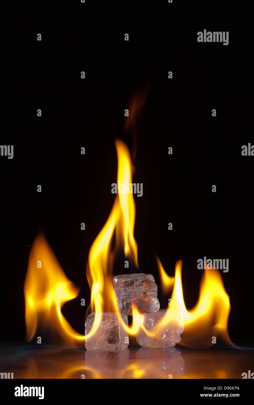 Ice cubes on fire giving off cool heat flames Stock Photo - Alamy