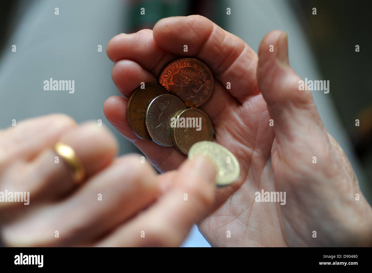 Elderly caucasian woman sorting out her money Stock Photo - Alamy