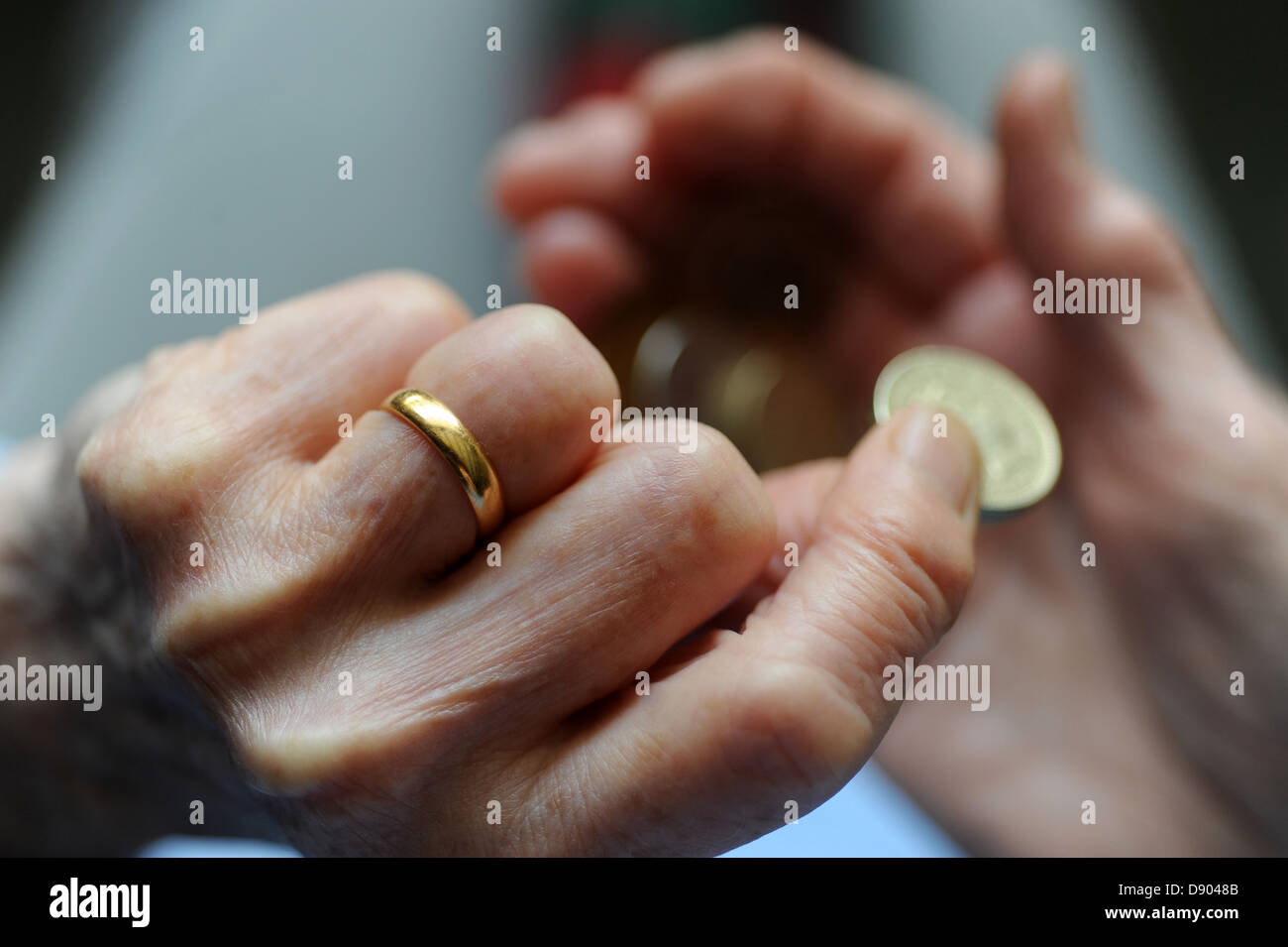 Elderly caucasian woman sorting out her money Stock Photo - Alamy