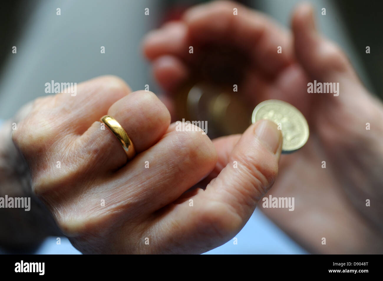 Elderly caucasian woman sorting out her money Stock Photo - Alamy
