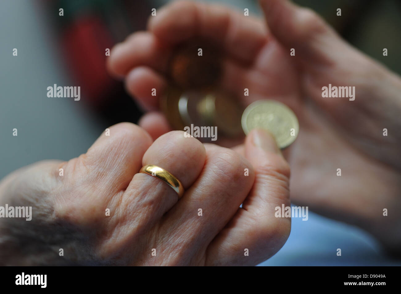 Elderly caucasian woman sorting out her money Stock Photo - Alamy