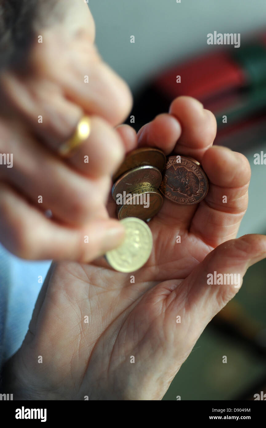 Elderly caucasian woman sorting out her money Stock Photo - Alamy
