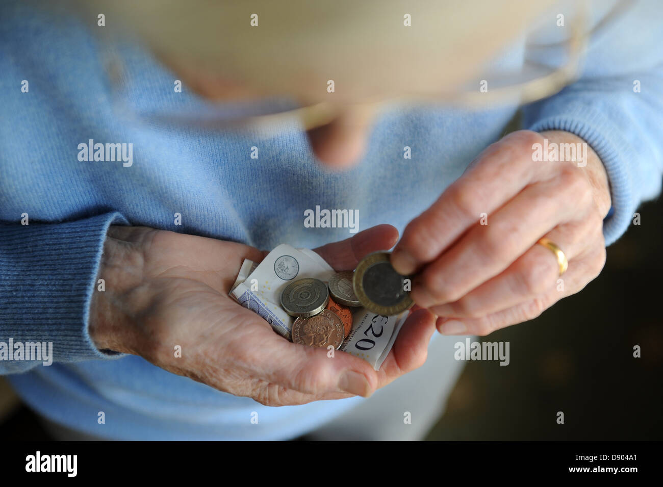 Elderly caucasian woman sorting out her money Stock Photo - Alamy