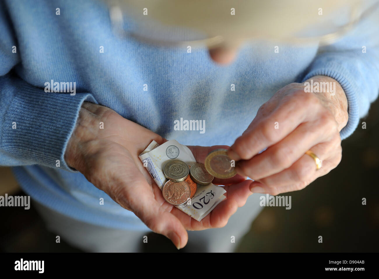 Elderly caucasian woman sorting out her money Stock Photo - Alamy