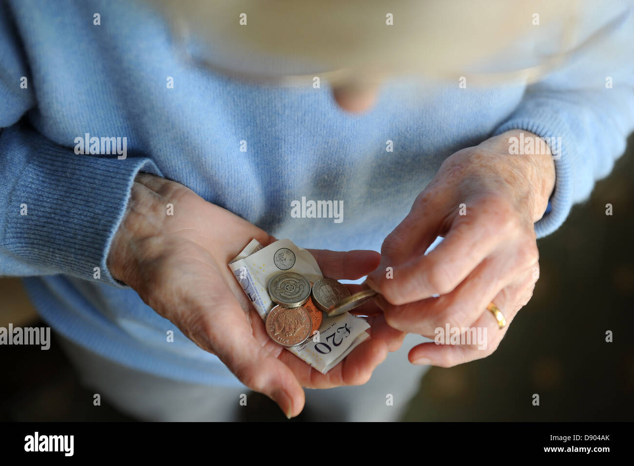 Elderly caucasian woman sorting out her money Stock Photo - Alamy