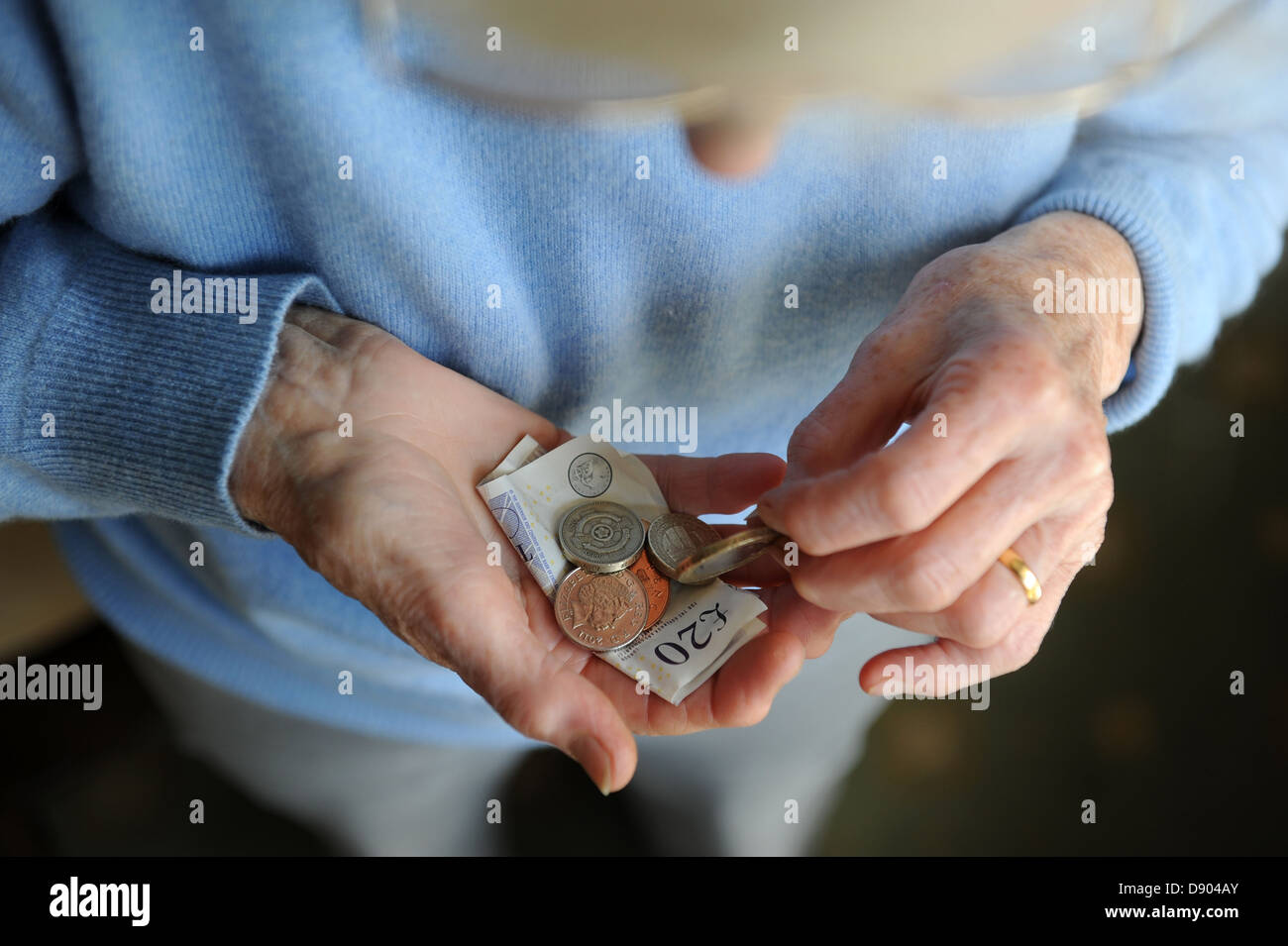 Hand sorting coins hi-res stock photography and images - Alamy