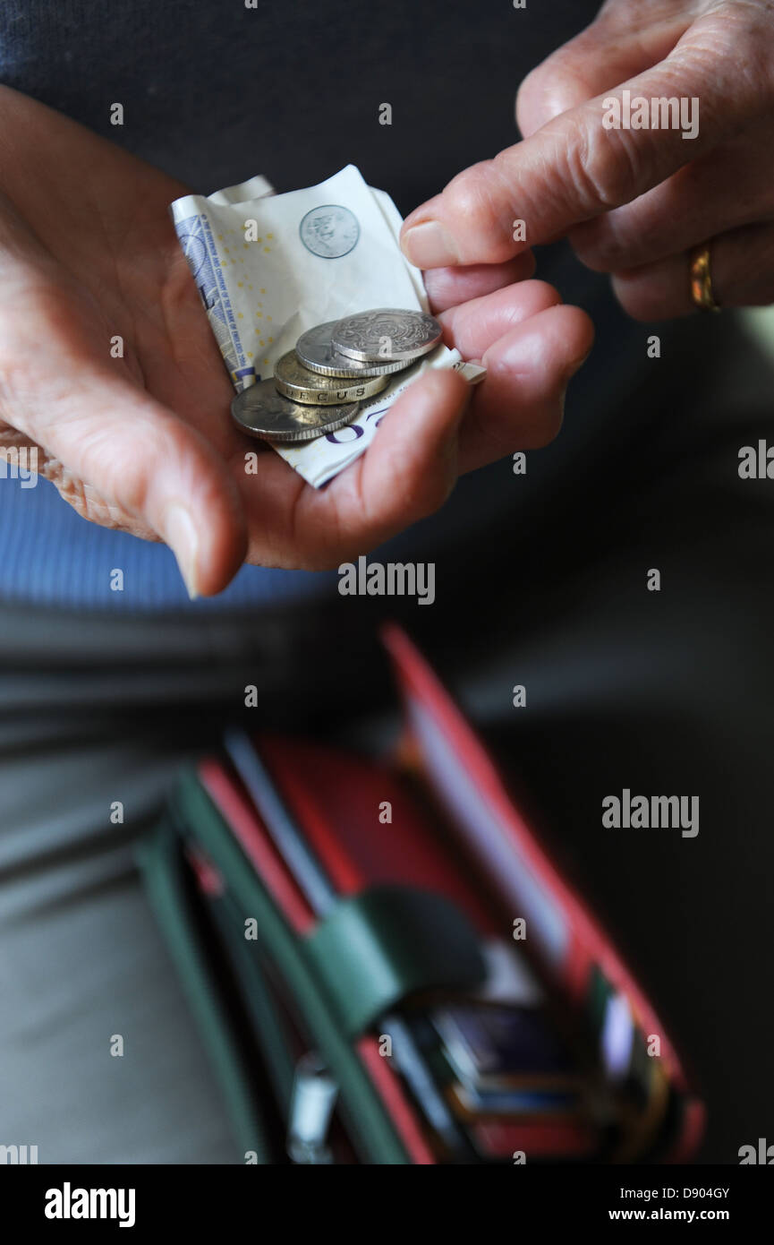 Elderly caucasian woman sorting out her money Stock Photo - Alamy
