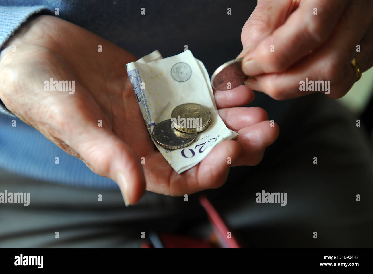 Elderly caucasian woman sorting out her money Stock Photo - Alamy