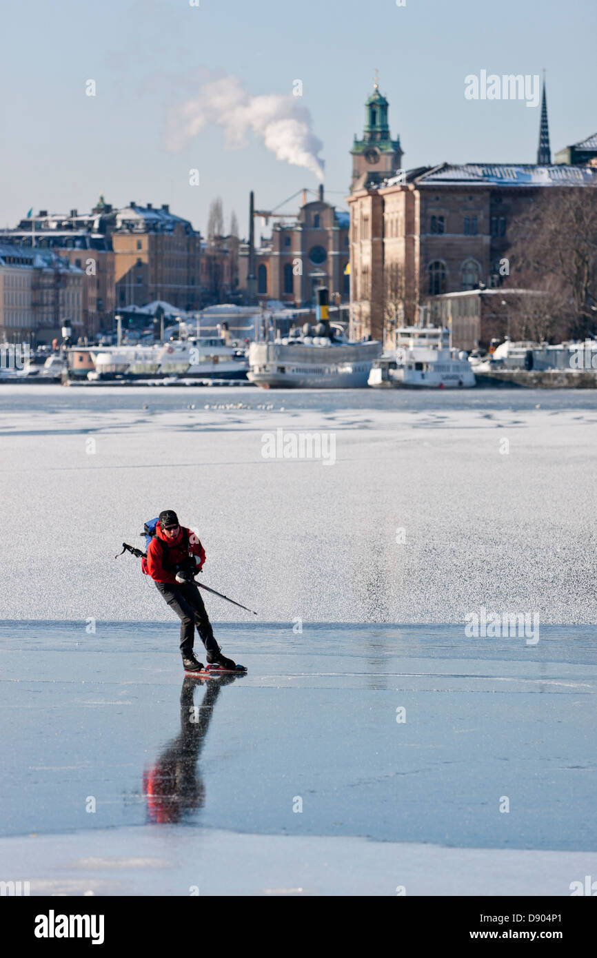 Man ice skating Stock Photo - Alamy