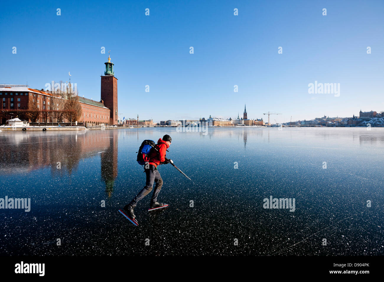 Man ice skating Stock Photo - Alamy