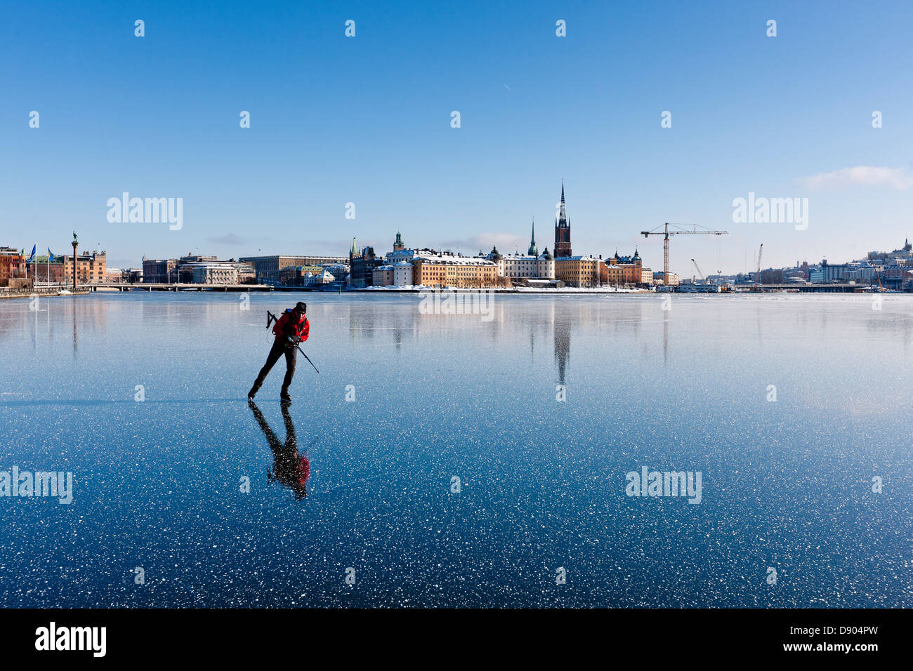 Man ice skating Stock Photo - Alamy