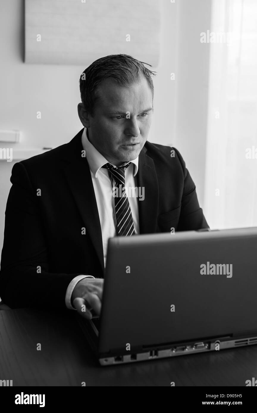 Person using laptop sitting desk Black and White Stock Photos & Images - Alamy